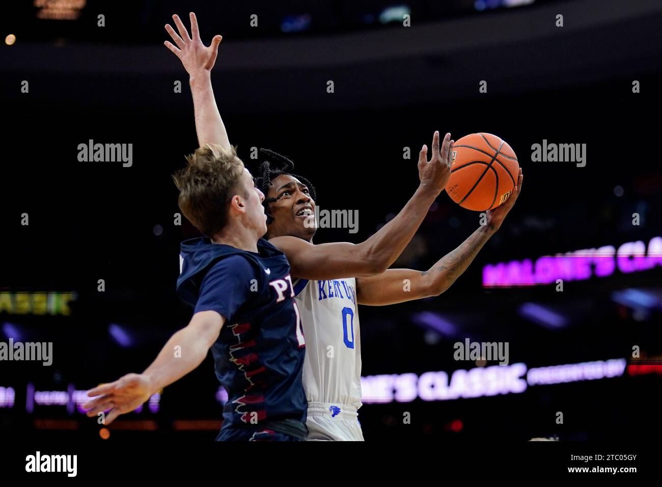 Kentucky's Rob Dillingham, right, goes up for a shot past Pennsylvania ...