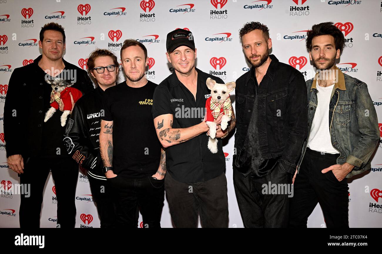 New York, USA. 09th Dec, 2023. Zach Filkins (holding Tinkerbelle The ...