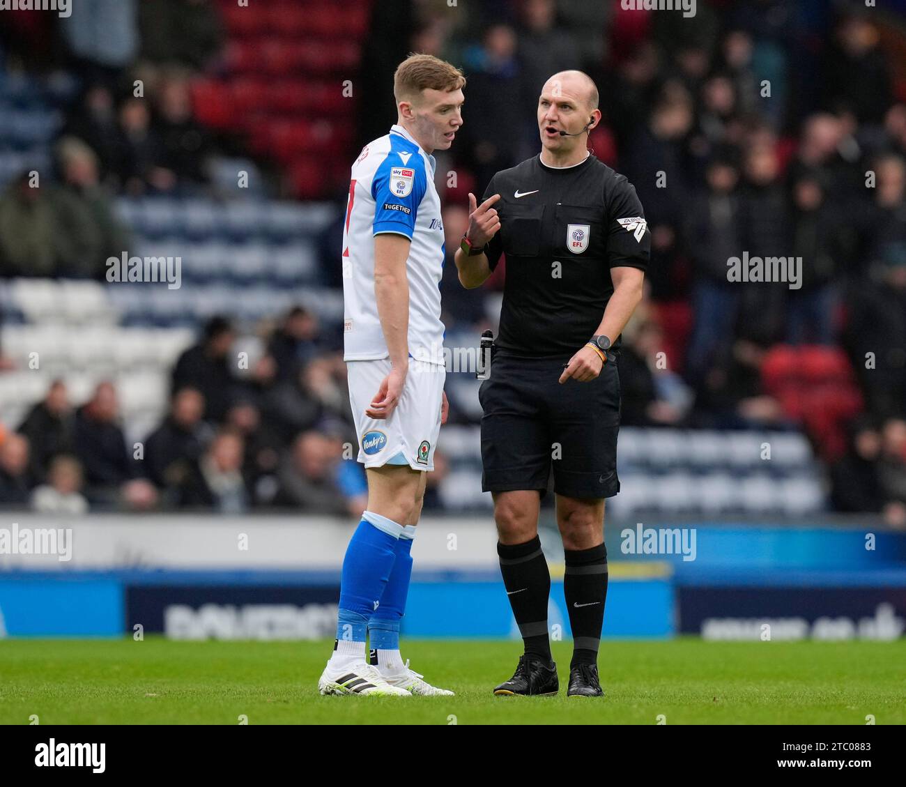 Referee Bobby Madeley speak with Hayden Carter #17 of Blackburn Rovers ...
