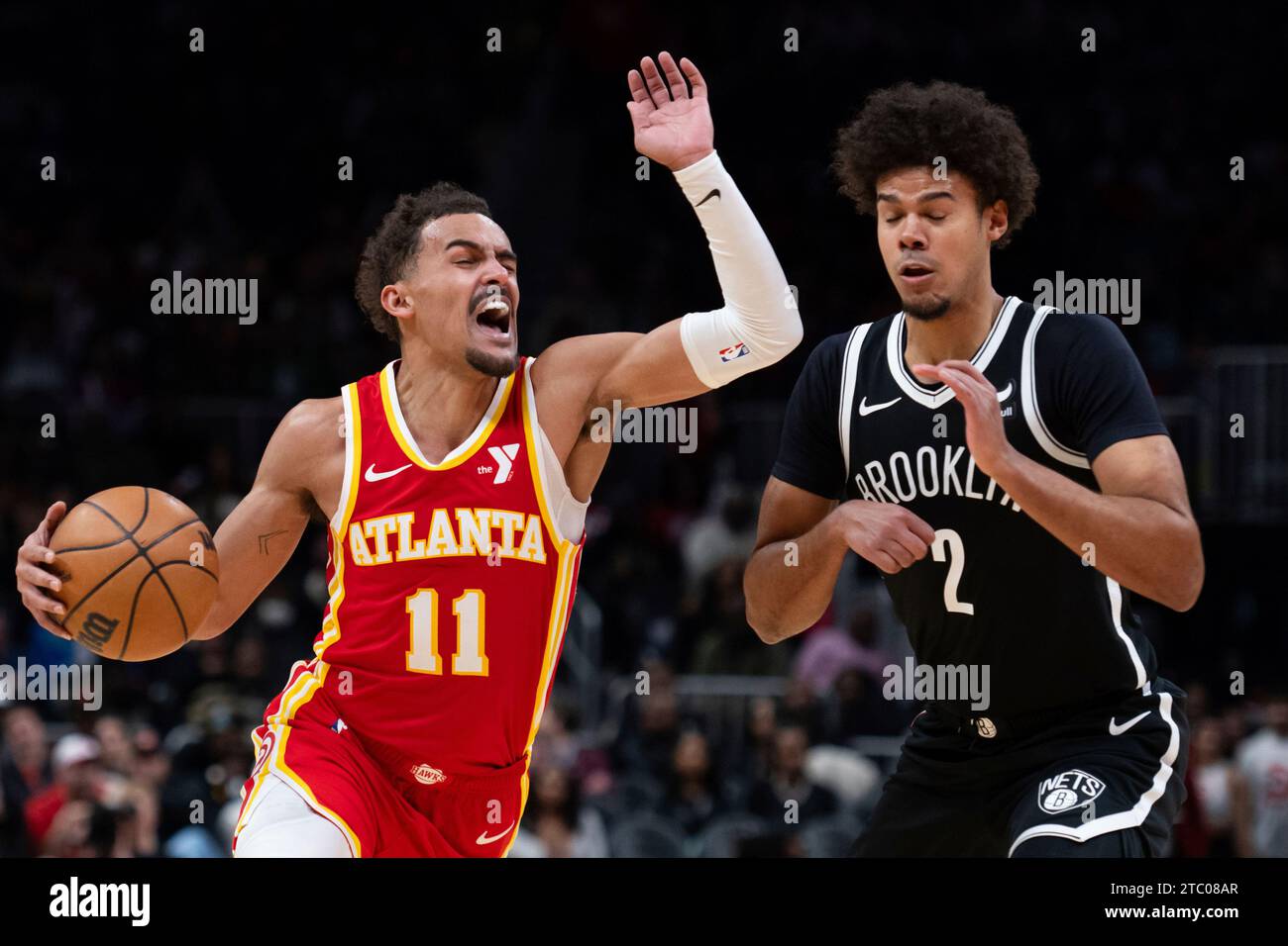 Atlanta Hawks guard Trae Young (11) is fouled by Brooklyn Nets forward ...
