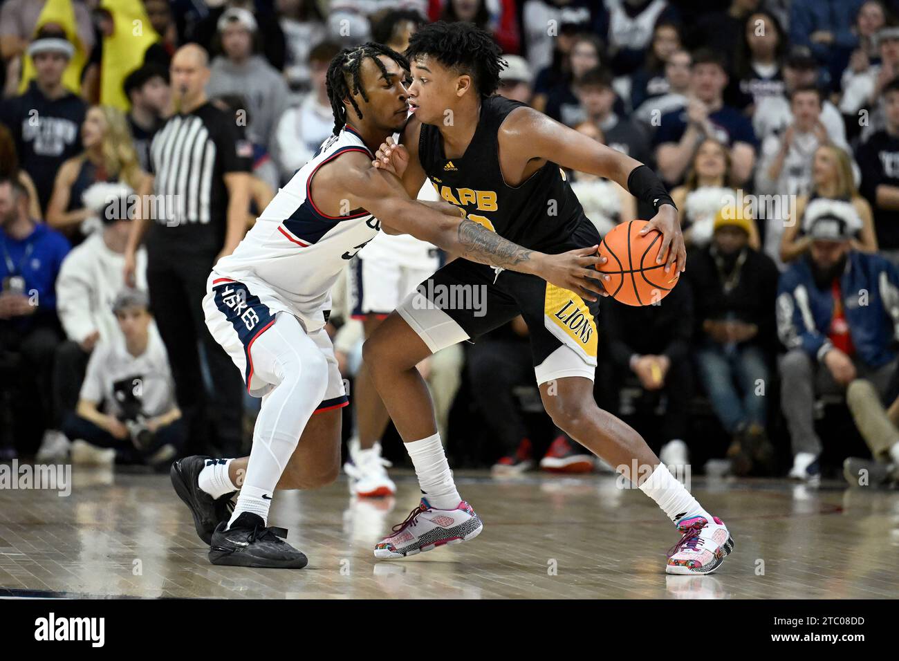 UConn guard Stephon Castle, left, pressures Arkansas-Pine Bluff forward ...