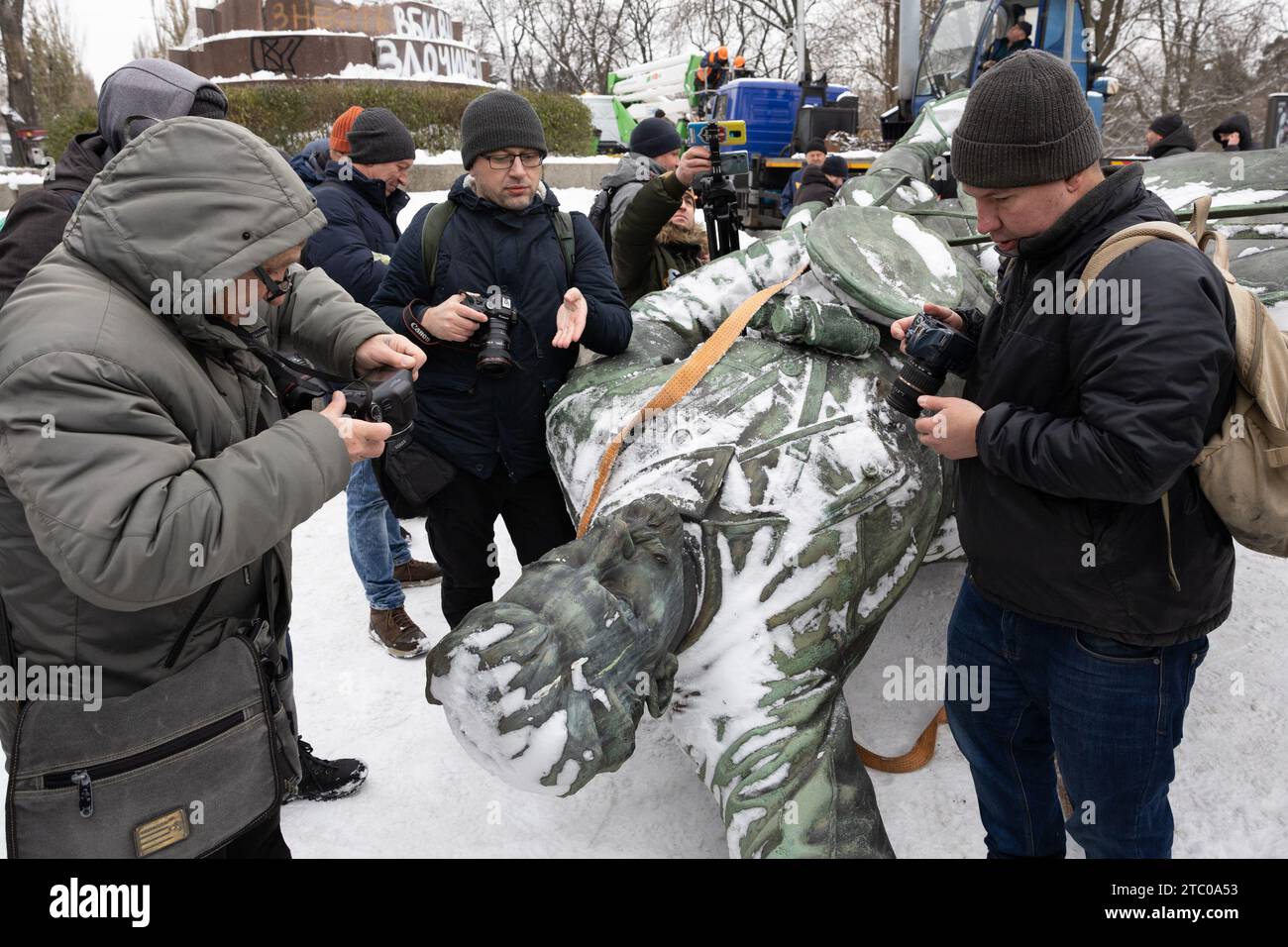 People and journalists take pictures of the monument of a Soviet field ...