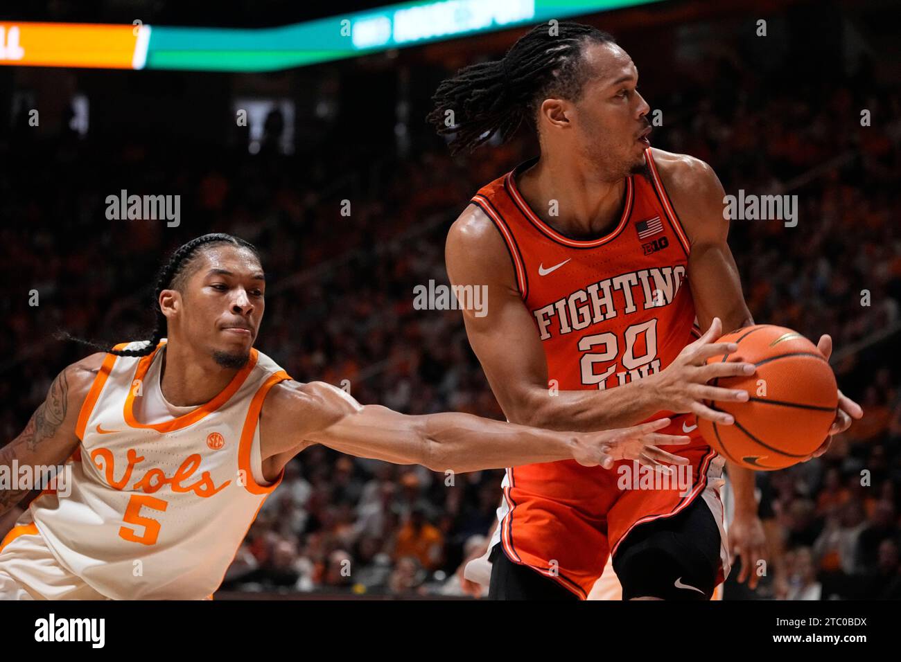 Illinois forward Ty Rodgers (20) pulls in a rebound past Tennessee ...