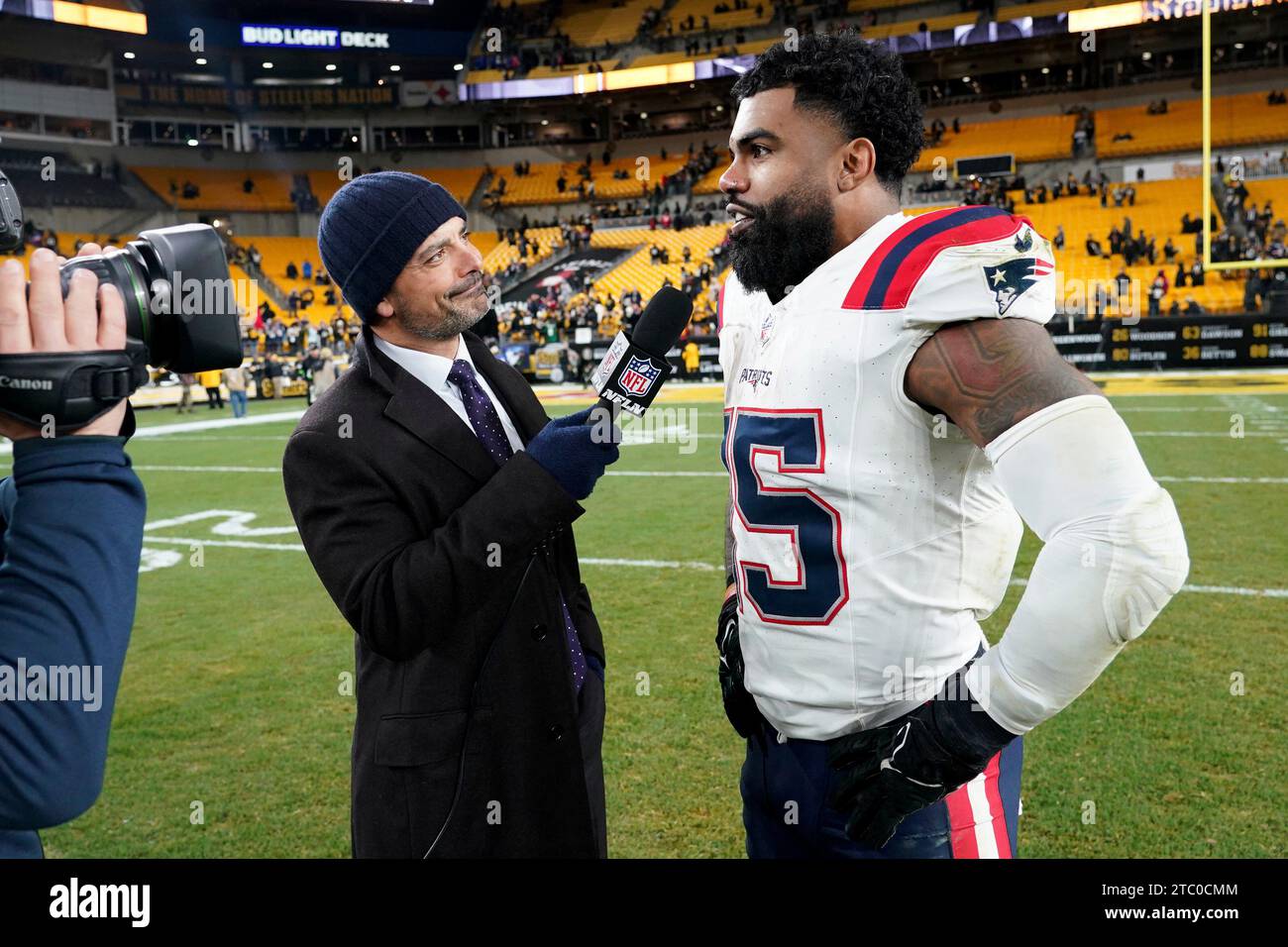 NFL sideline reporter Mike Garafolo interviews New England Patriots ...
