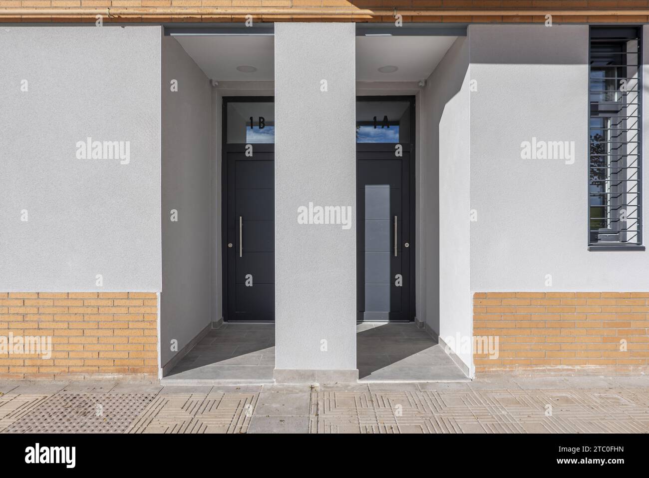 Entrance to loft-style apartments at street level Stock Photo - Alamy