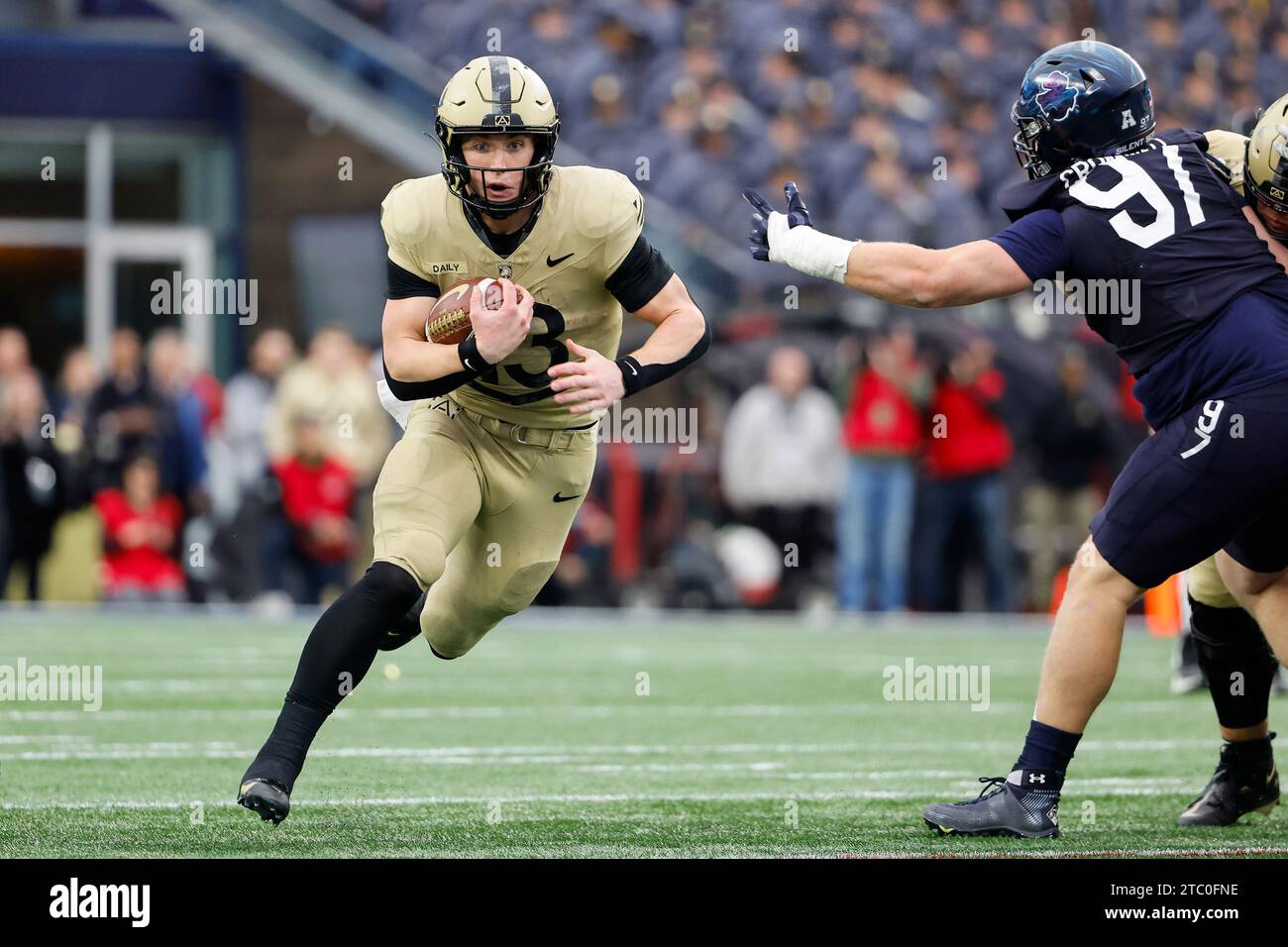 Army quarterback Bryson Daily runs through a hole past Navy defensive ...