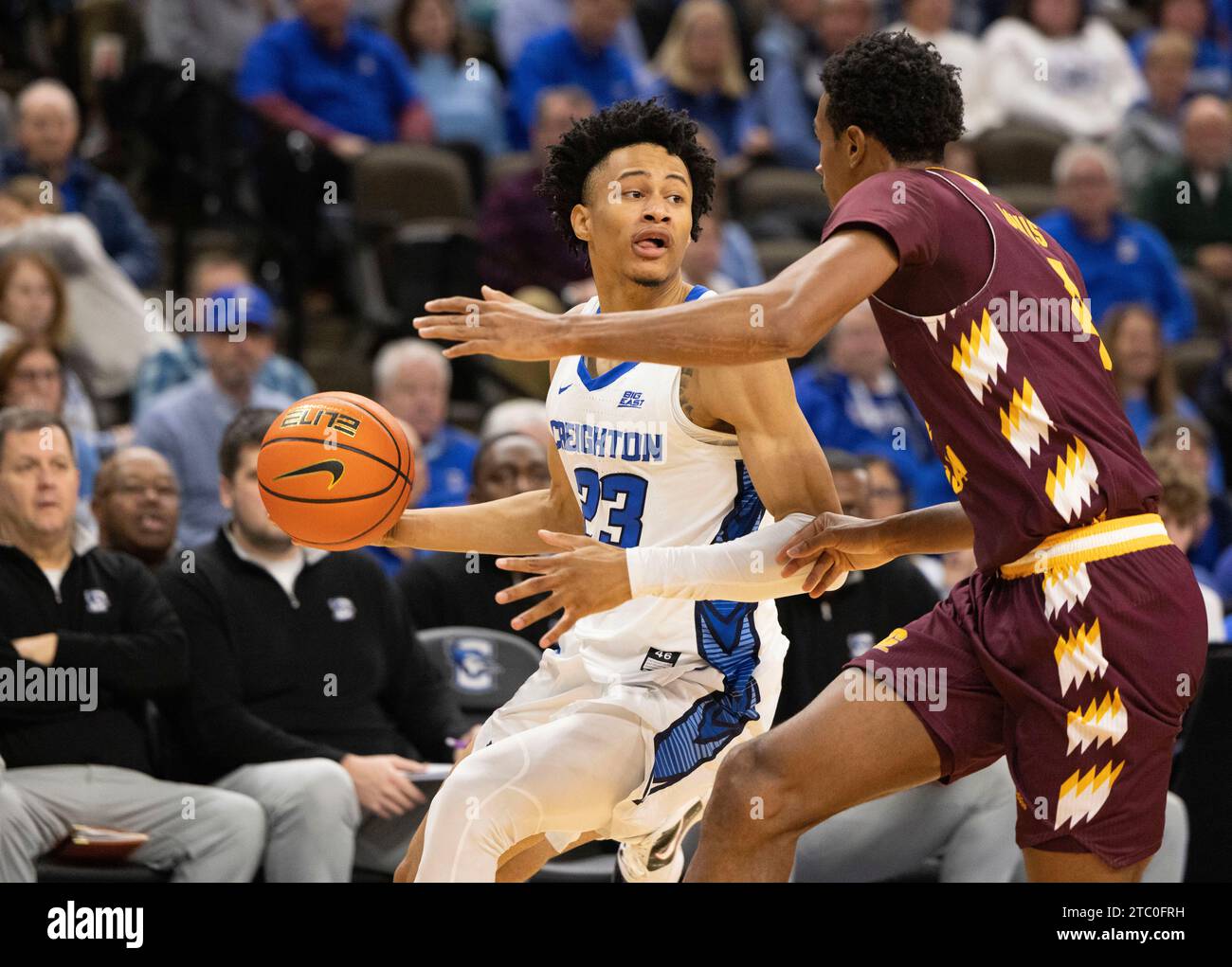 Creighton's Trey Alexander, left, drives against Central Michigan's ...