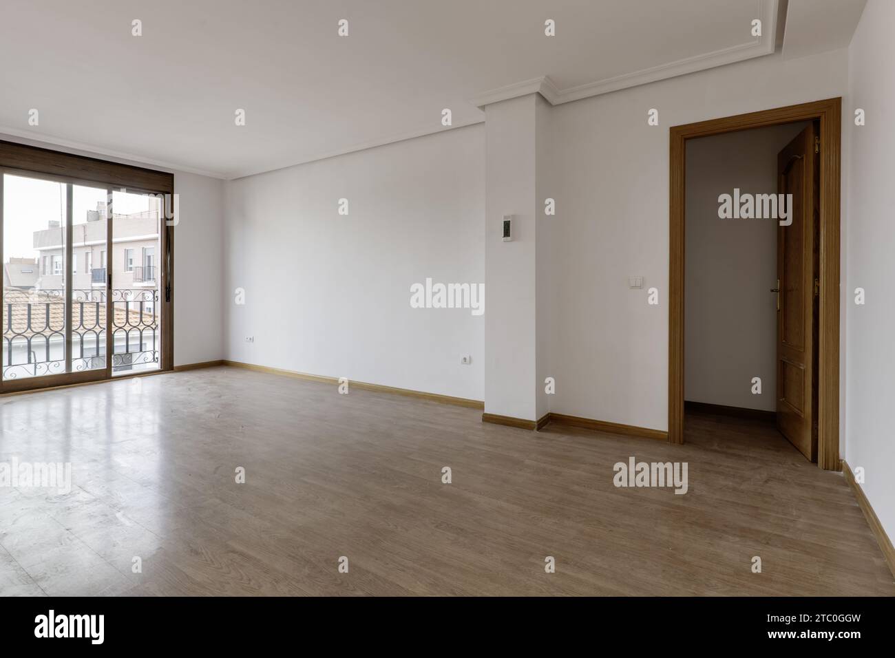 Empty living room with dusty wooden floors and a French window Stock ...