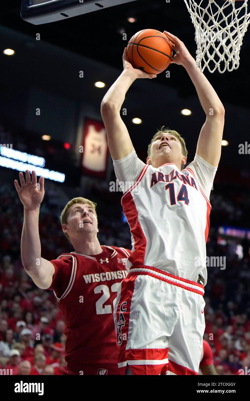 Arizona center Motiejus Krivas (14) shoots over Wisconsin forward ...