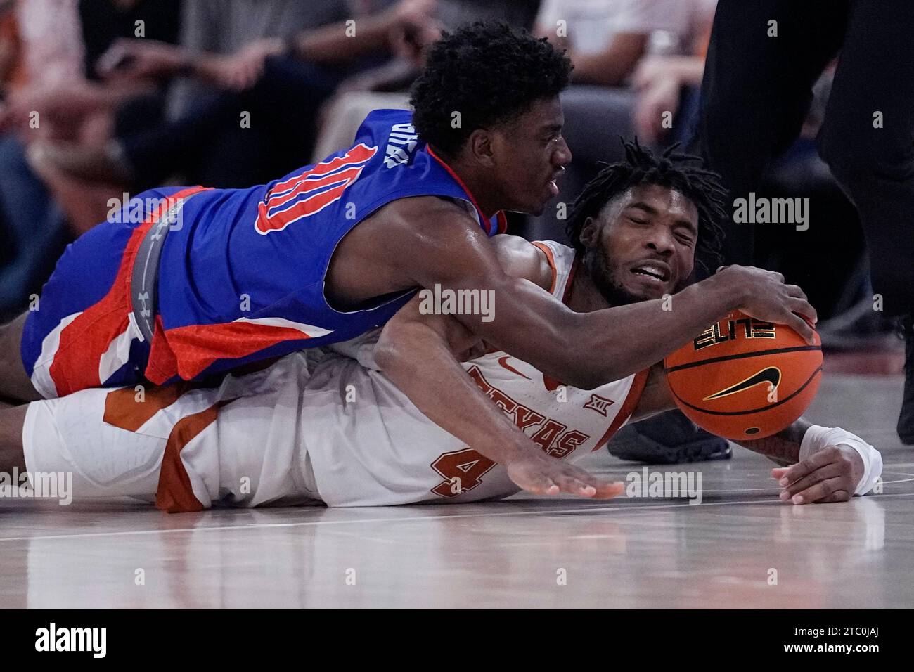 Houston Christian guard Marcus Greene (10) and Texas guard Tyrese ...