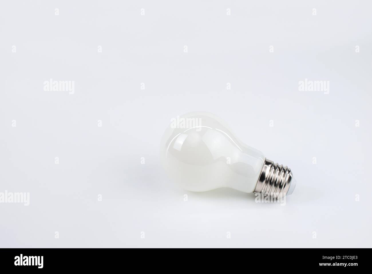 Light bulb casting reflections on a bright surface. Dynamic play of ...