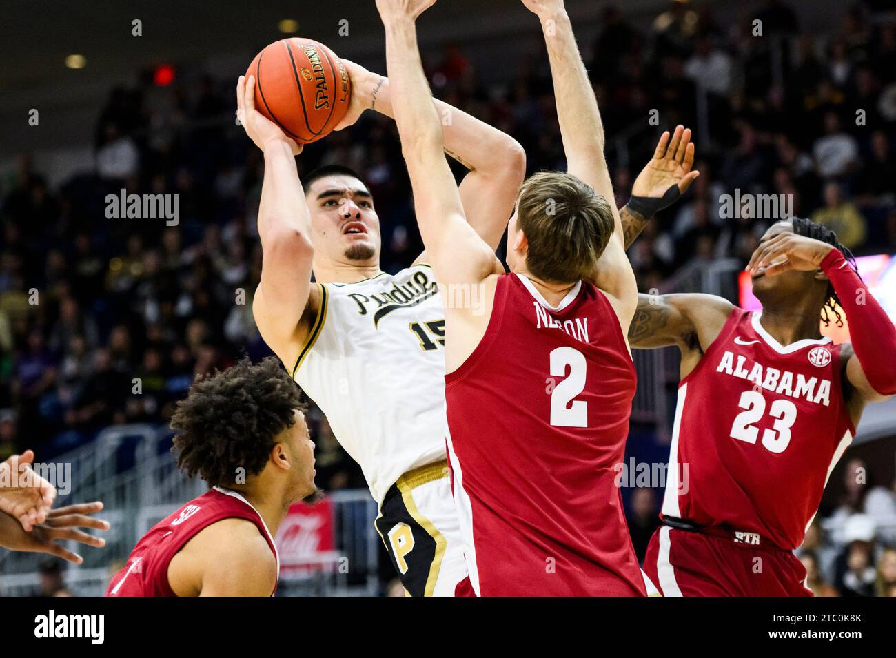 Purdue center Zach Edey (15) shoots while defended by Alabama forward ...