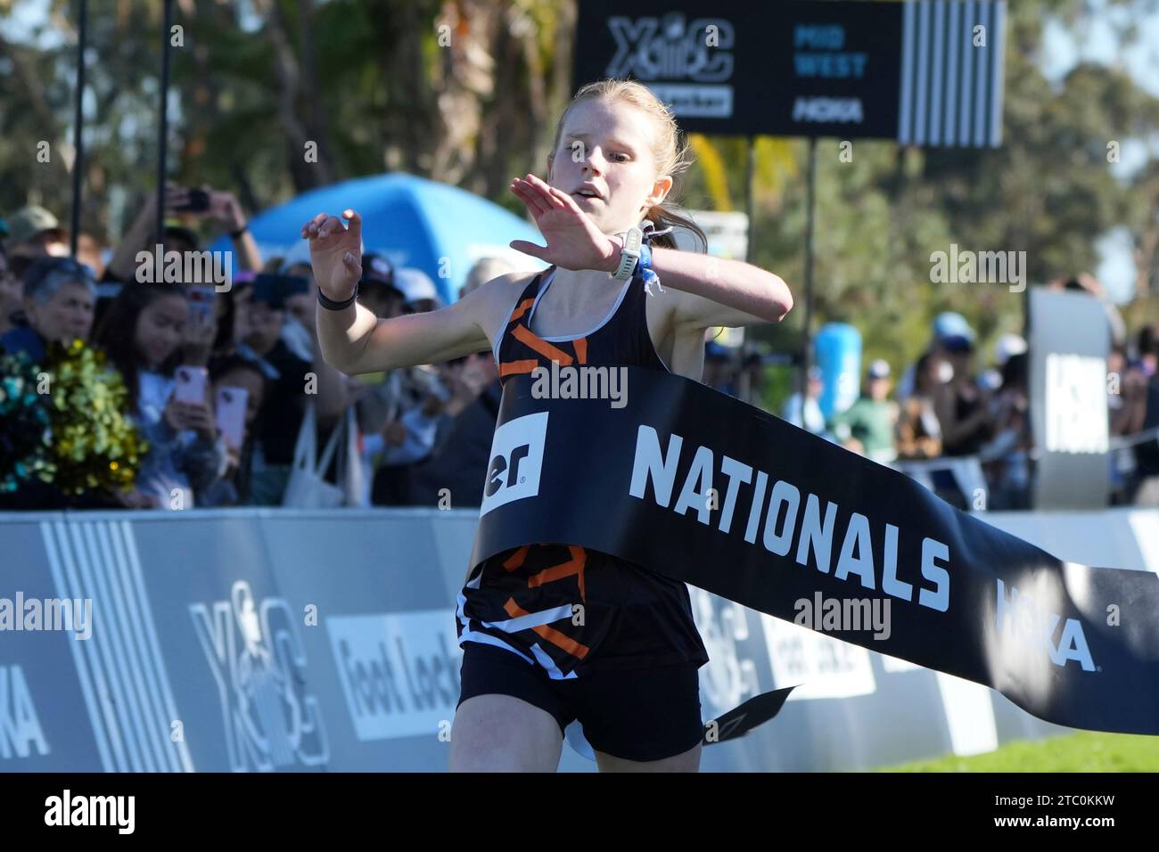 Elizabeth Leachman celebrates after winning the girls race in 16:50.7 ...