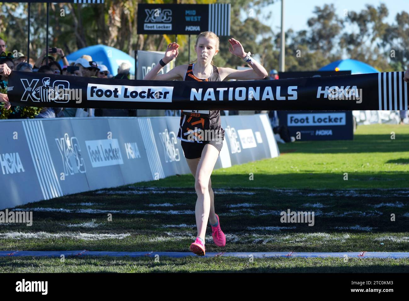 Elizabeth Leachman celebrates after winning the girls race in 16:50.7 ...