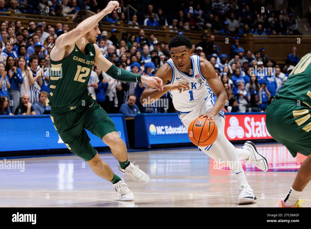 Duke's Caleb Foster (1) drives against Charlotte's Jackson Threadgill ...