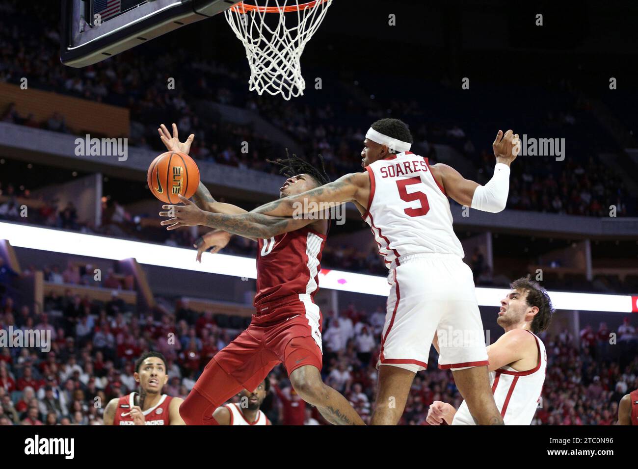 Arkansas guard Khalif Battle (0) is fouled by Oklahoma guard Rivaldo ...