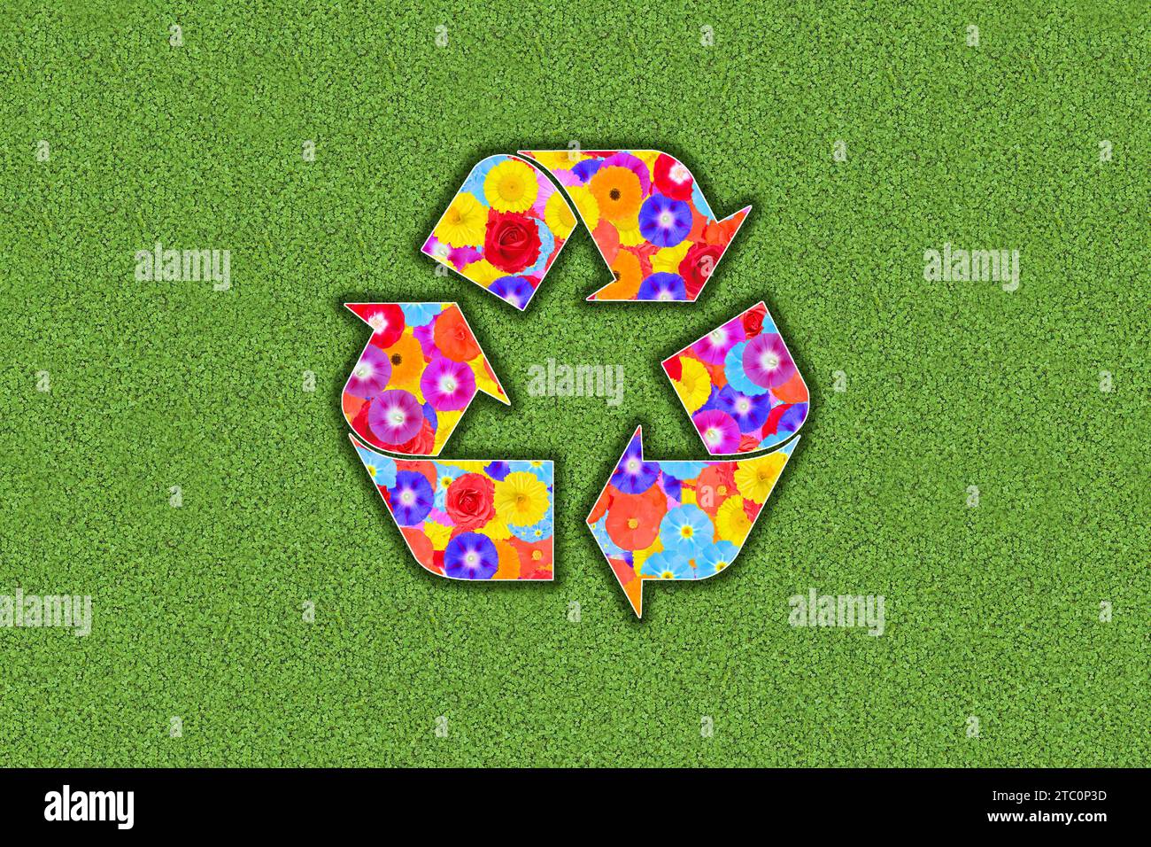 Sign for recycling, symbol, with many different colored flowers on a ...
