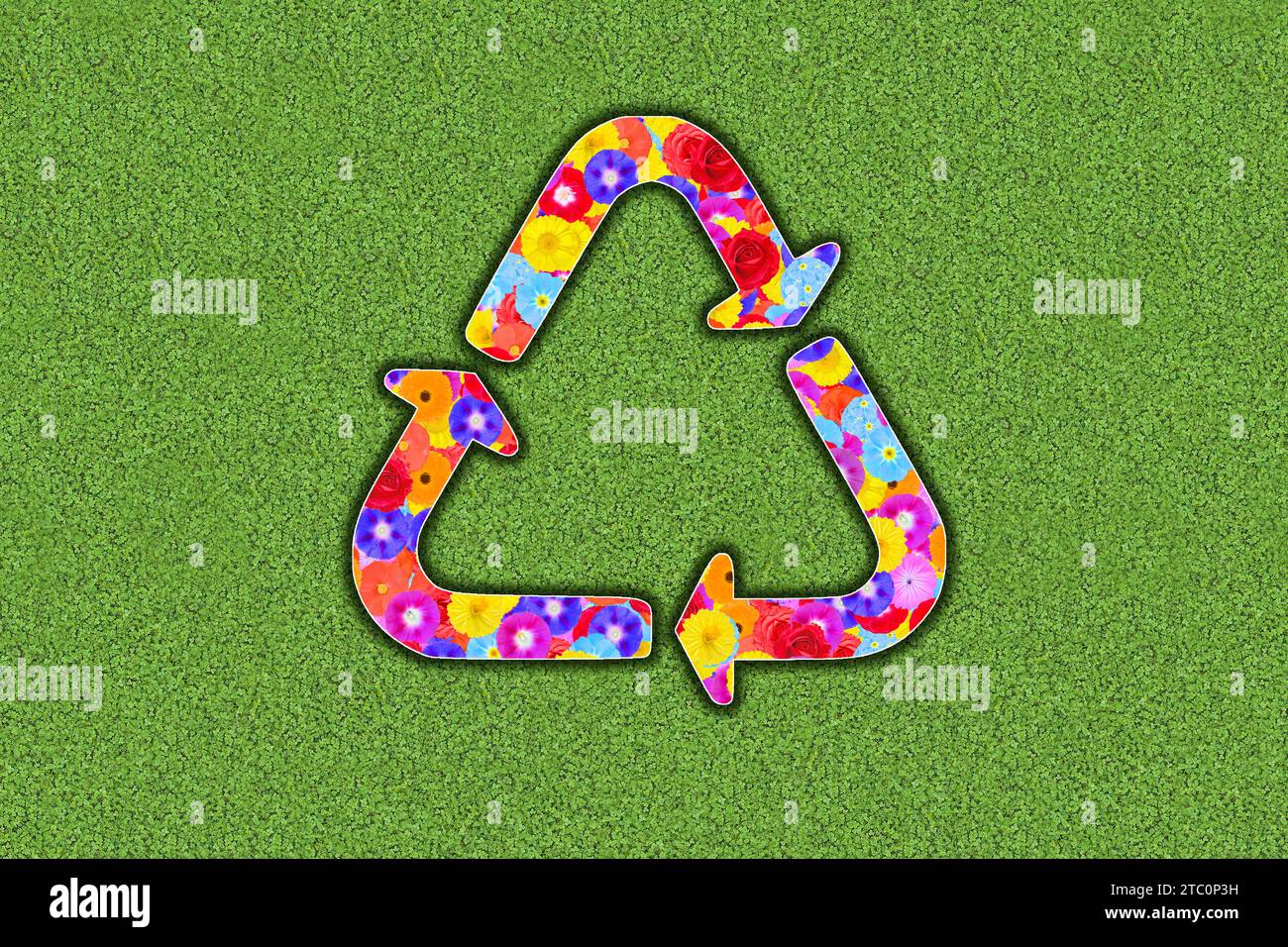 Sign for recycling, symbol, with many different colored flowers on a ...