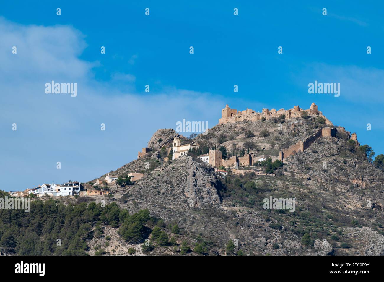 View of the fortified Andalusian village of Moclín on top of a mountain ...