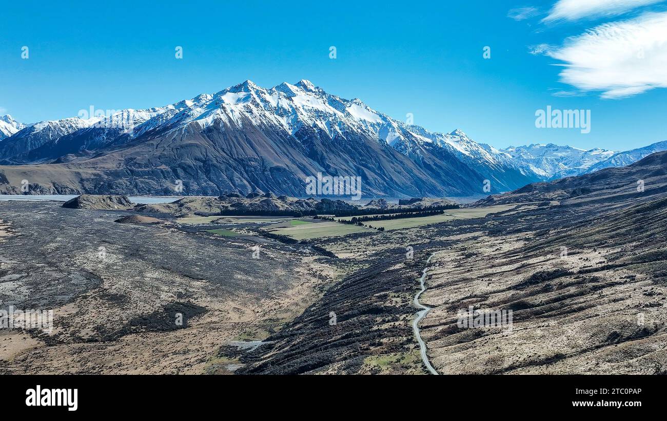 The dry arid alpine Hakatere conservation park bordered by the snow ...