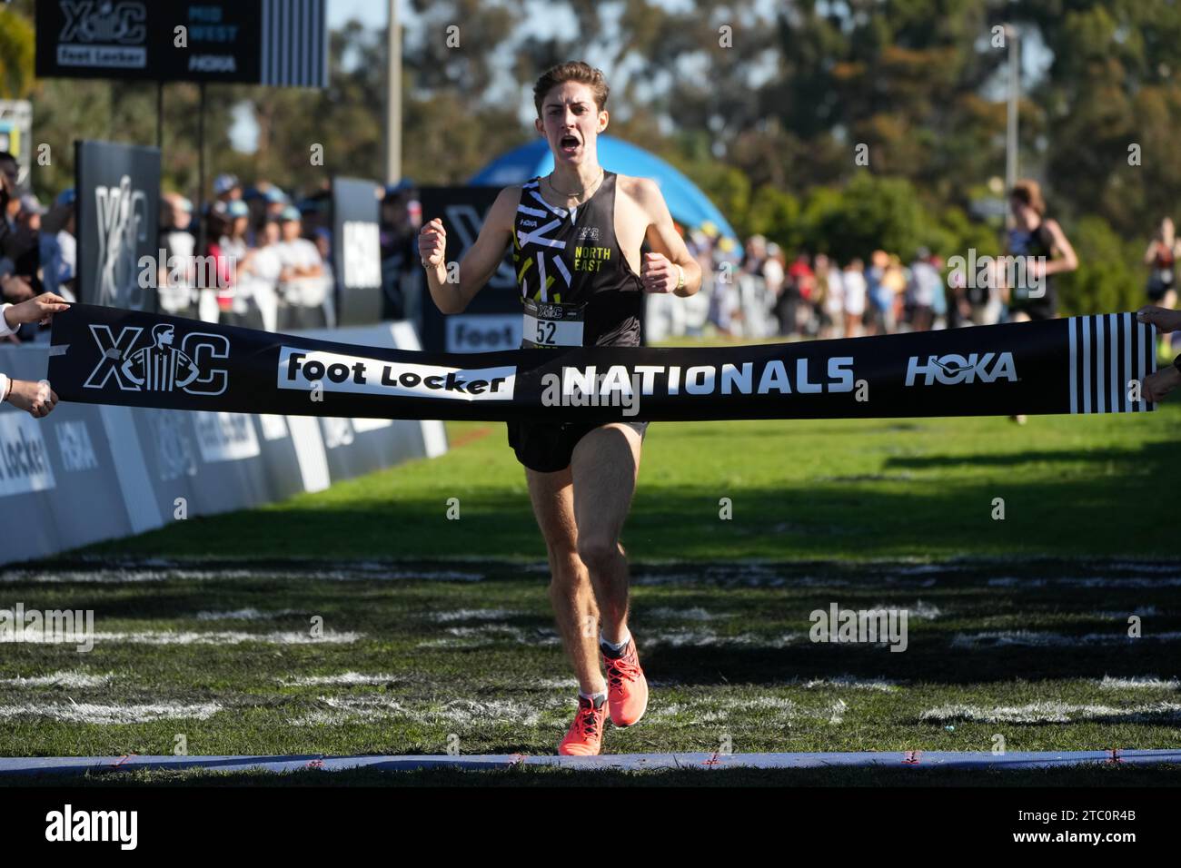 Drew Griffith celebrates after winning the boys race in 15:06.9 during ...