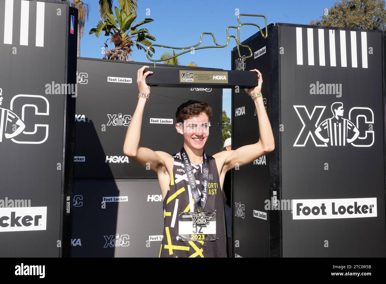 Drew Griffith poses with trophy after winning the boys race in 15:06.9 ...