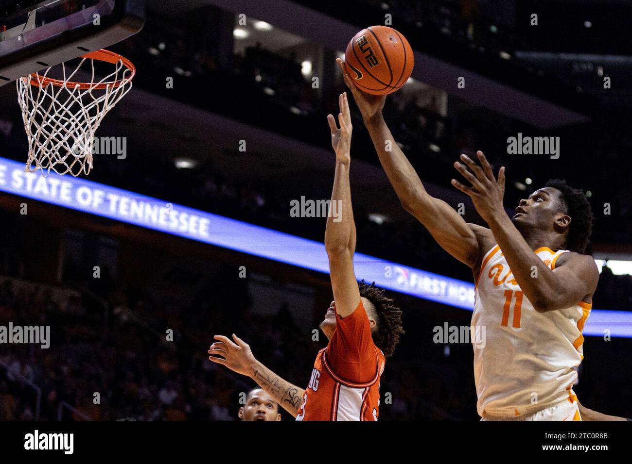 Tennessee forward Tobe Awaka (11) grabs a rebound away from Illinois ...