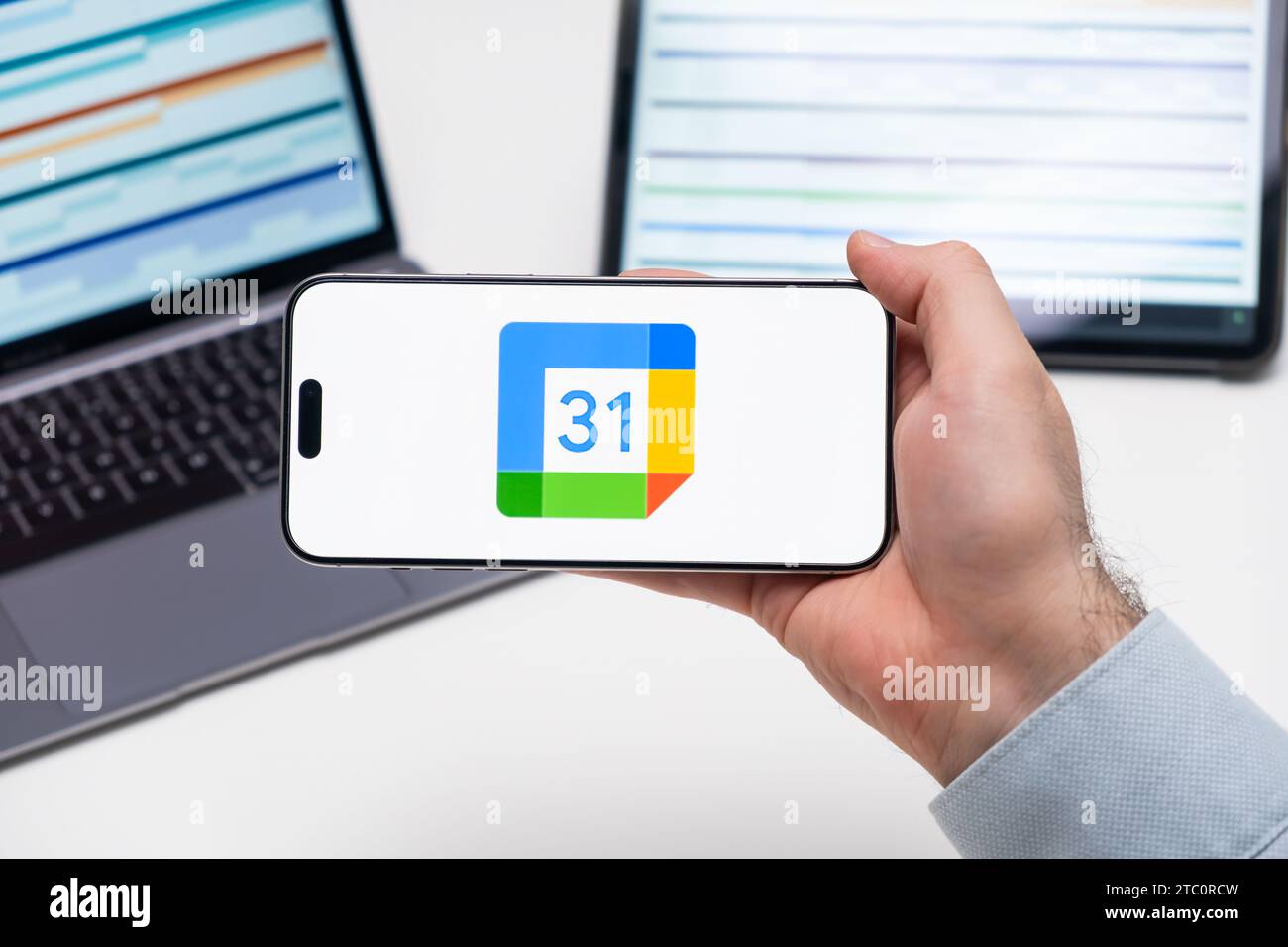 Google Calendar logo on the screen of a smartphone in mans hand with ...