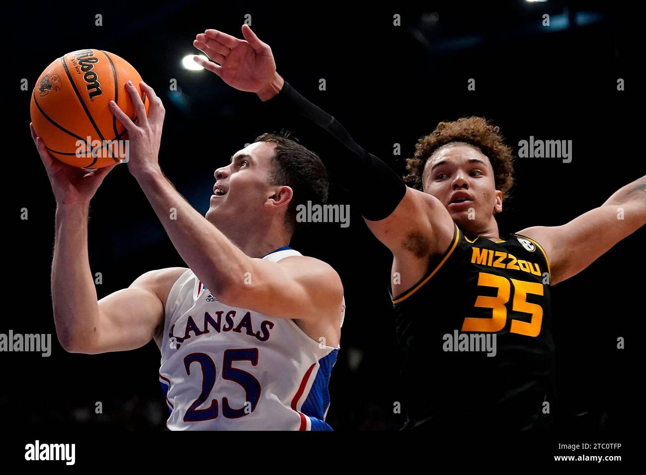 Kansas guard Nicolas Timberlake (25) shoots under pressure from ...