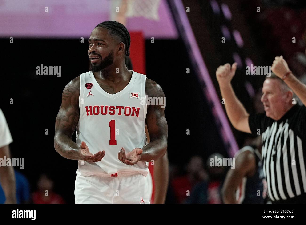 Houston guard Jamal Shead (1) reacts after being called for a block ...