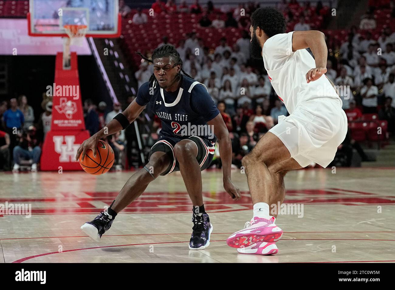 Jackson State guard Ken Evans Jr. is defended by Houston guard Damian ...