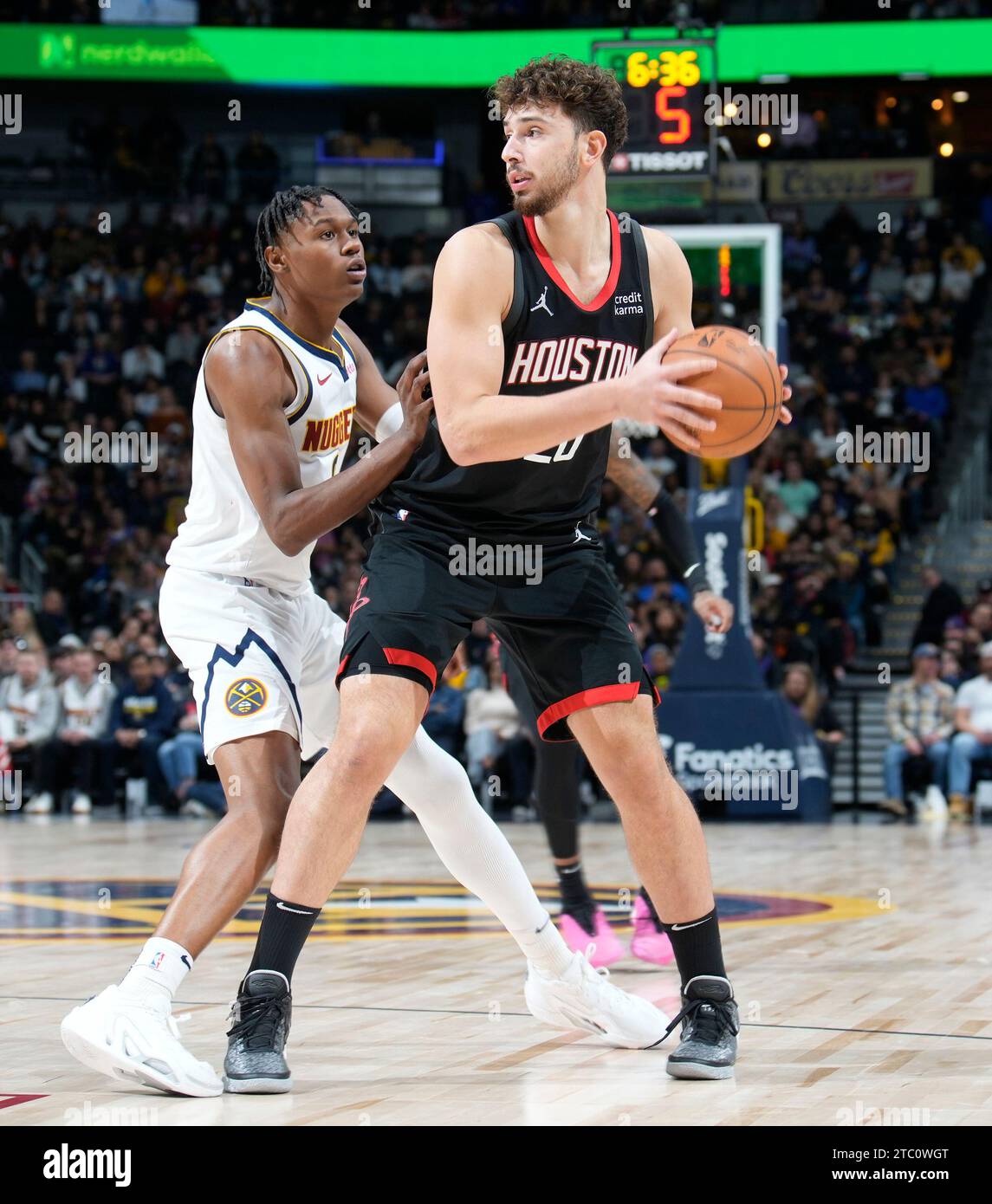 Denver Nuggets forward Peyton Watson (8) covers Houston Rockets center Alperen Sengun (28) in ...