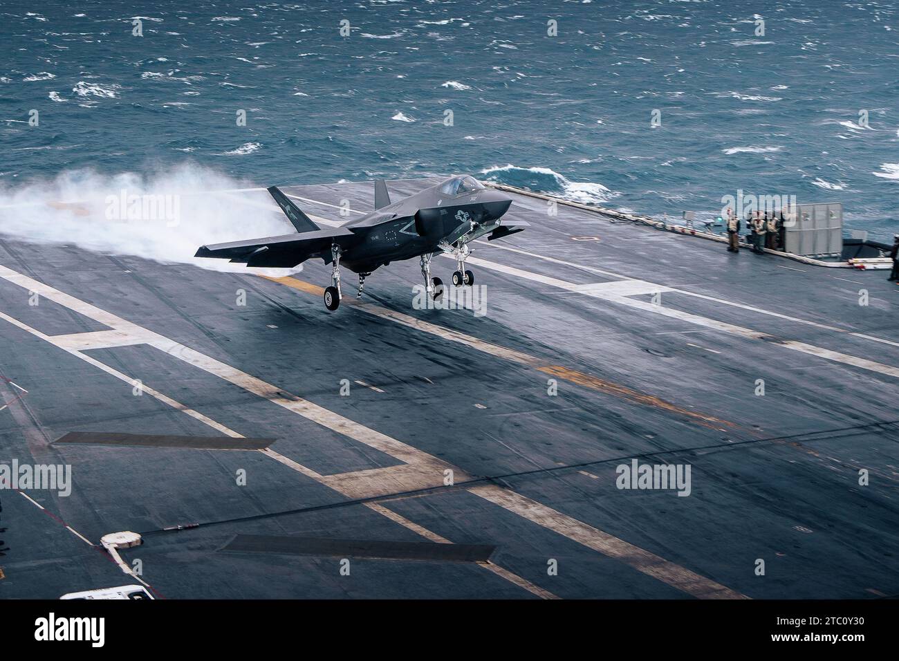 An F-35C Lightning II, from Strike Fighter Squadron (VFA) 147, lands on the flight deck of ...
