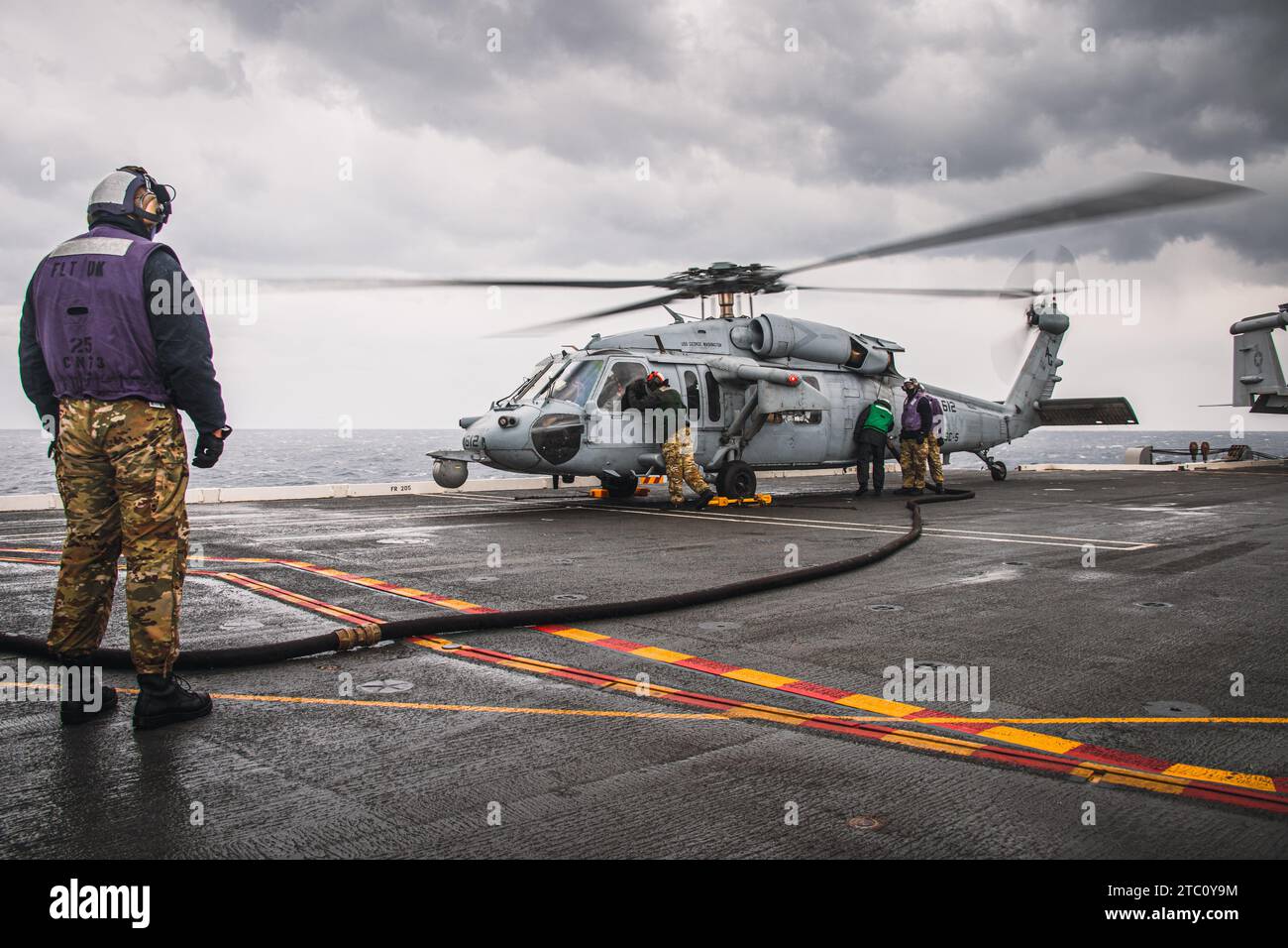 An MH-60S Seahawk, attached to Helicopter Sea Combat Squadron (HSC) 5 ...