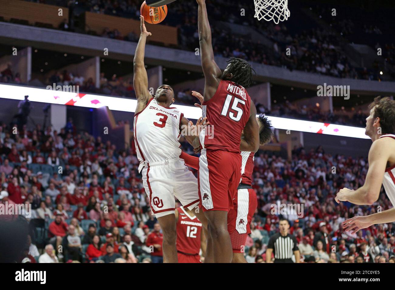 Oklahoma guard Otega Oweh (3) shoots past Arkansas Razorbacks forward ...