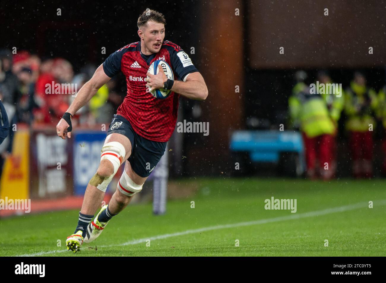 Limerick, Ireland. 09th Dec, 2023. Tom Ahern of Munster runs with the ...