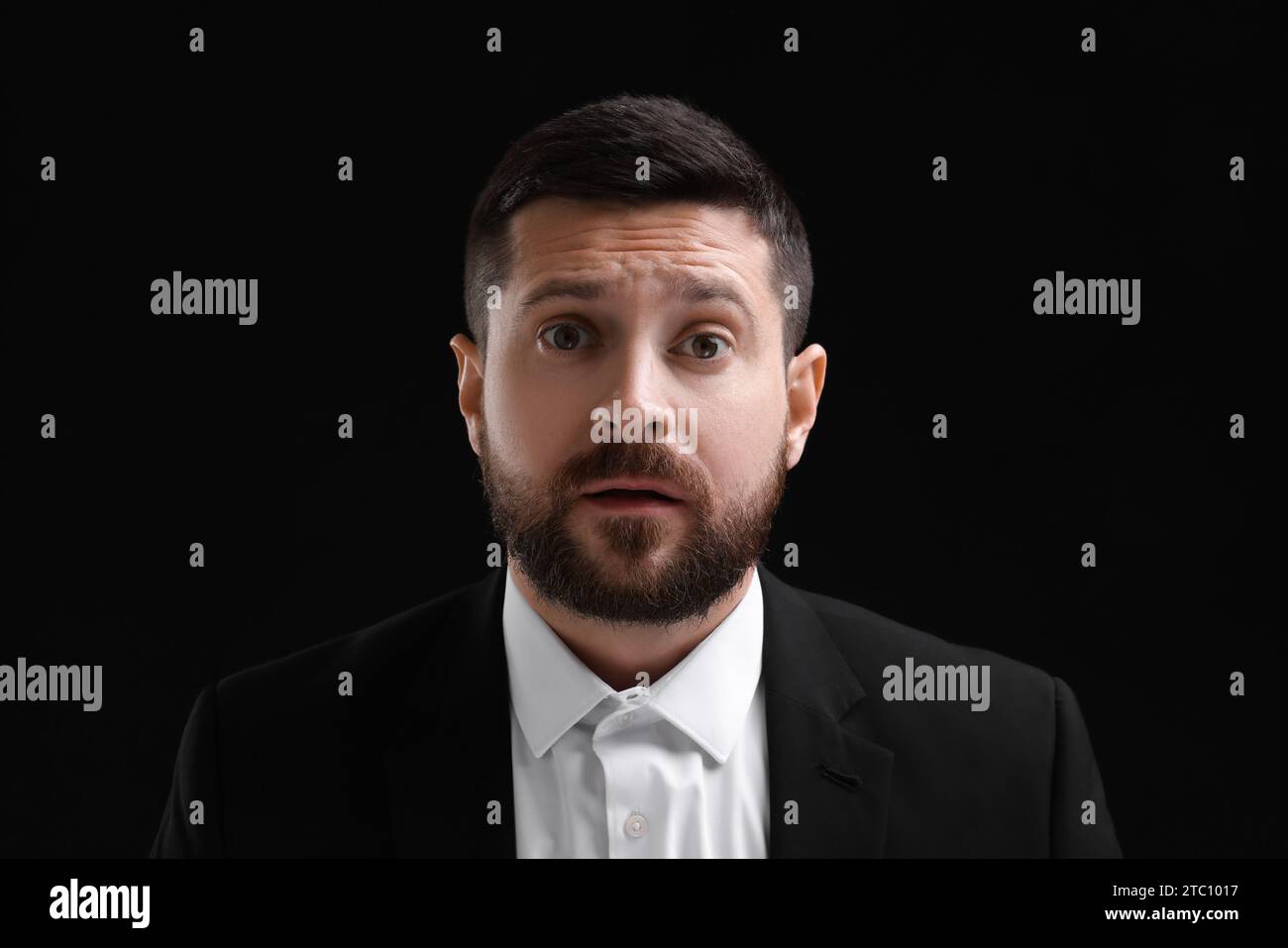 Personality concept. Emotional man on black background Stock Photo - Alamy