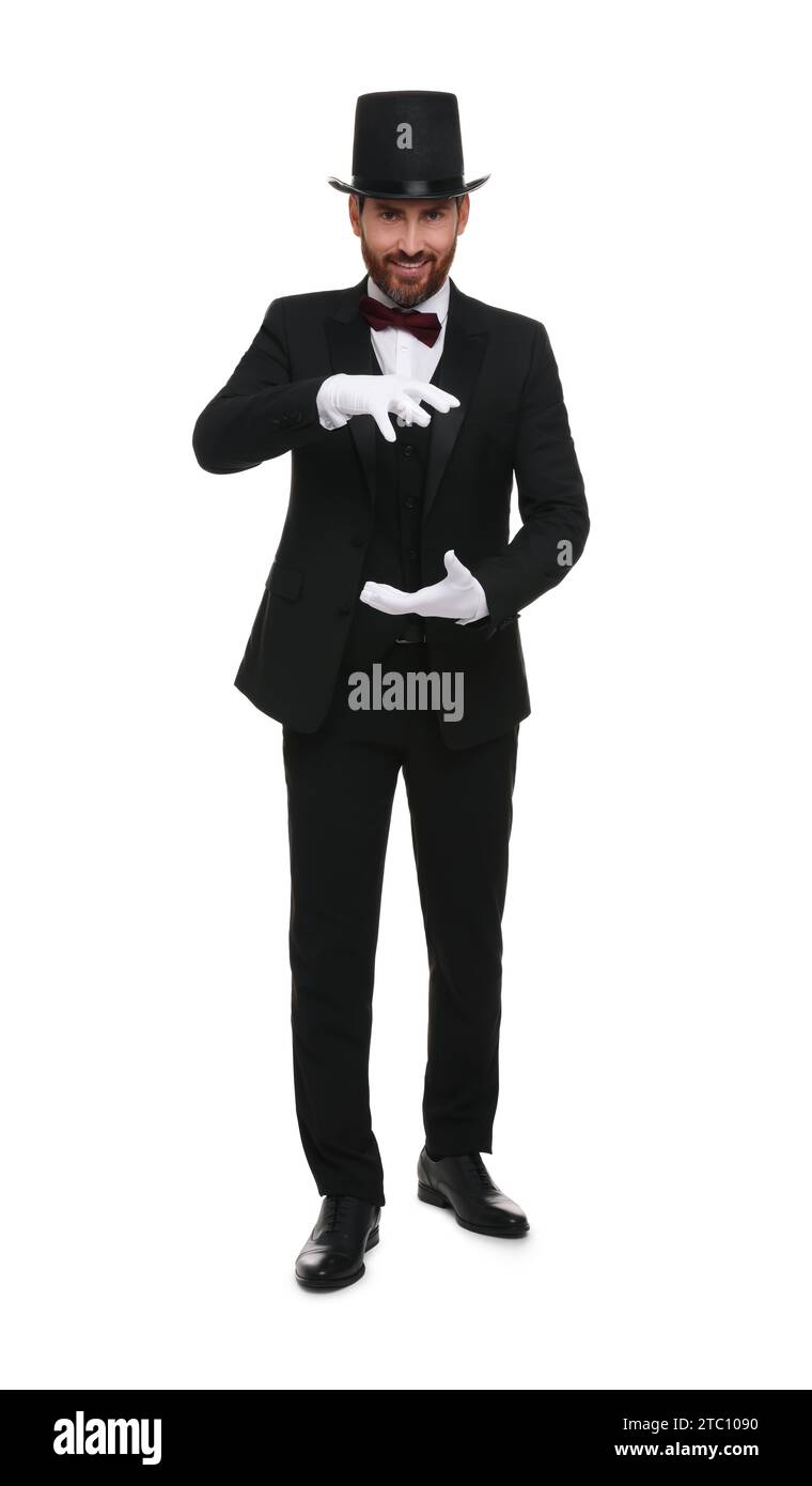 Happy magician in top hat holding something on white background Stock ...
