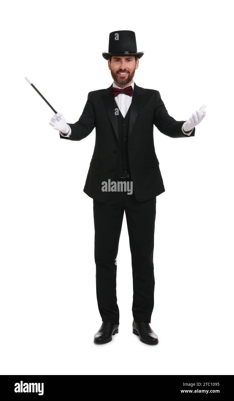 Happy magician in top hat holding wand on white background Stock Photo ...