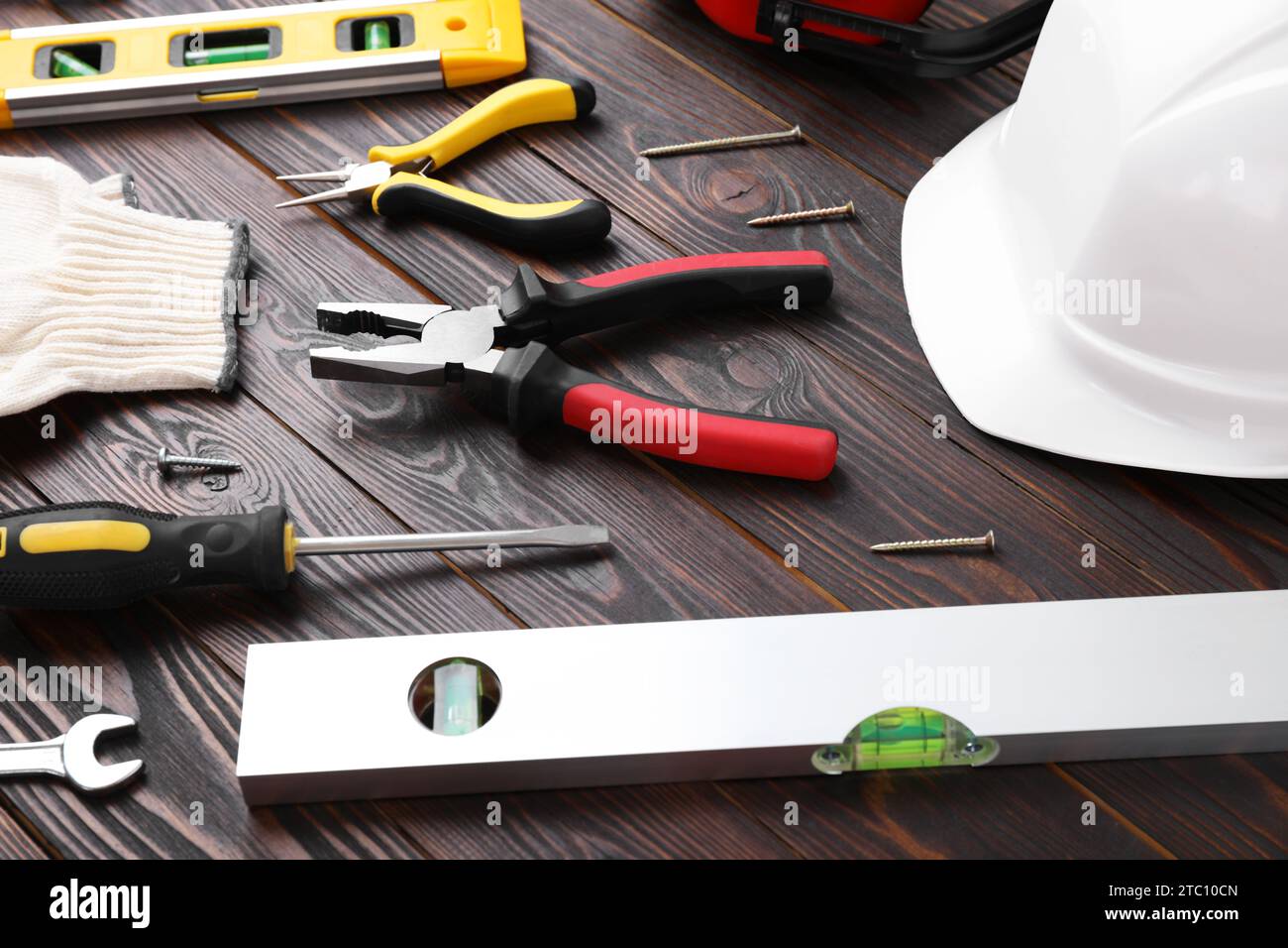 Different modern construction tools on wooden background Stock Photo ...
