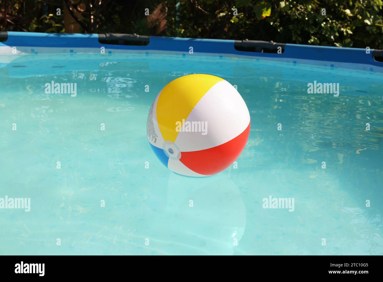 Inflatable ball on water in above ground swimming pool outdoors Stock ...