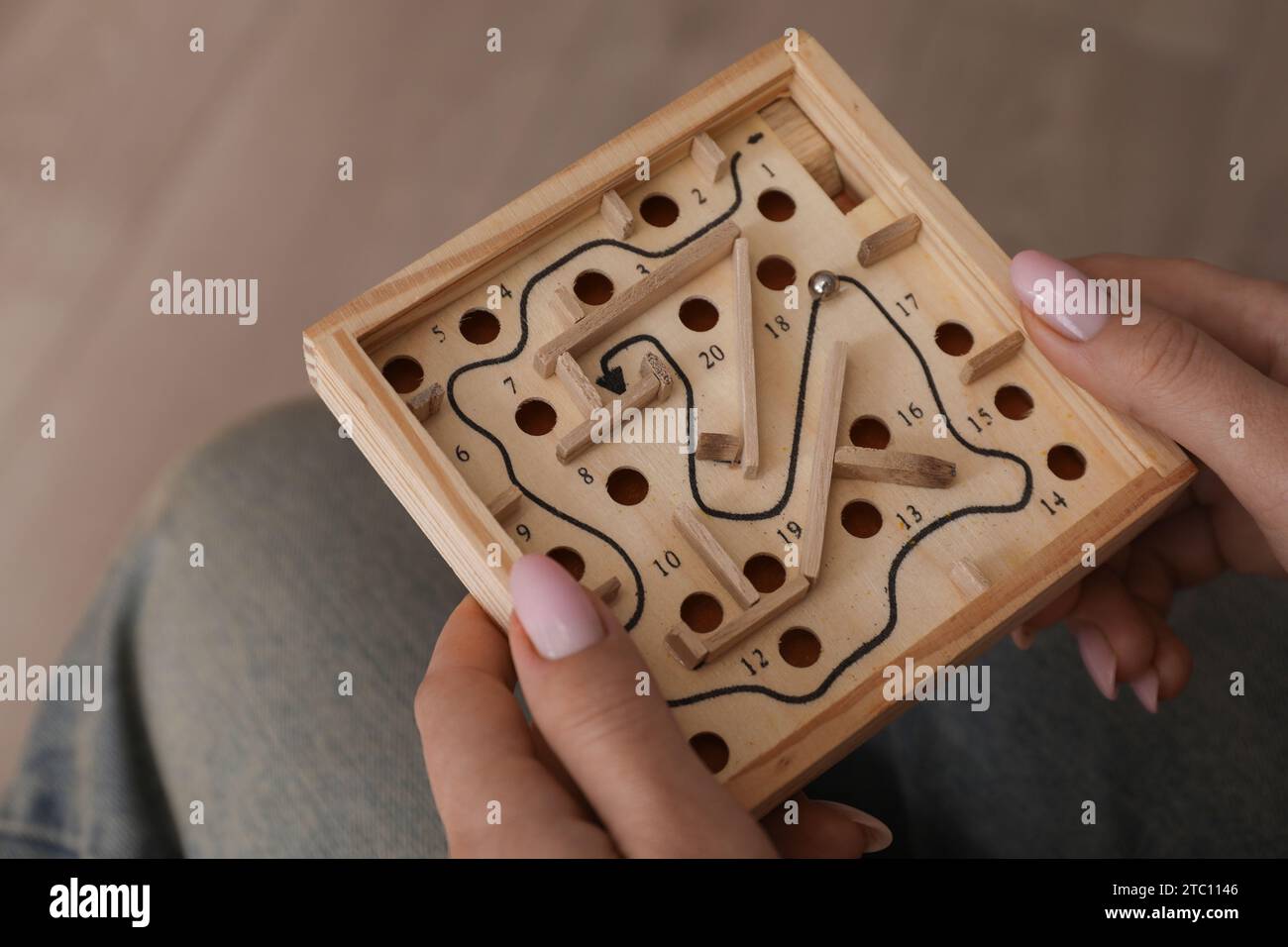 Metal ball maze game hi-res stock photography and images - Alamy