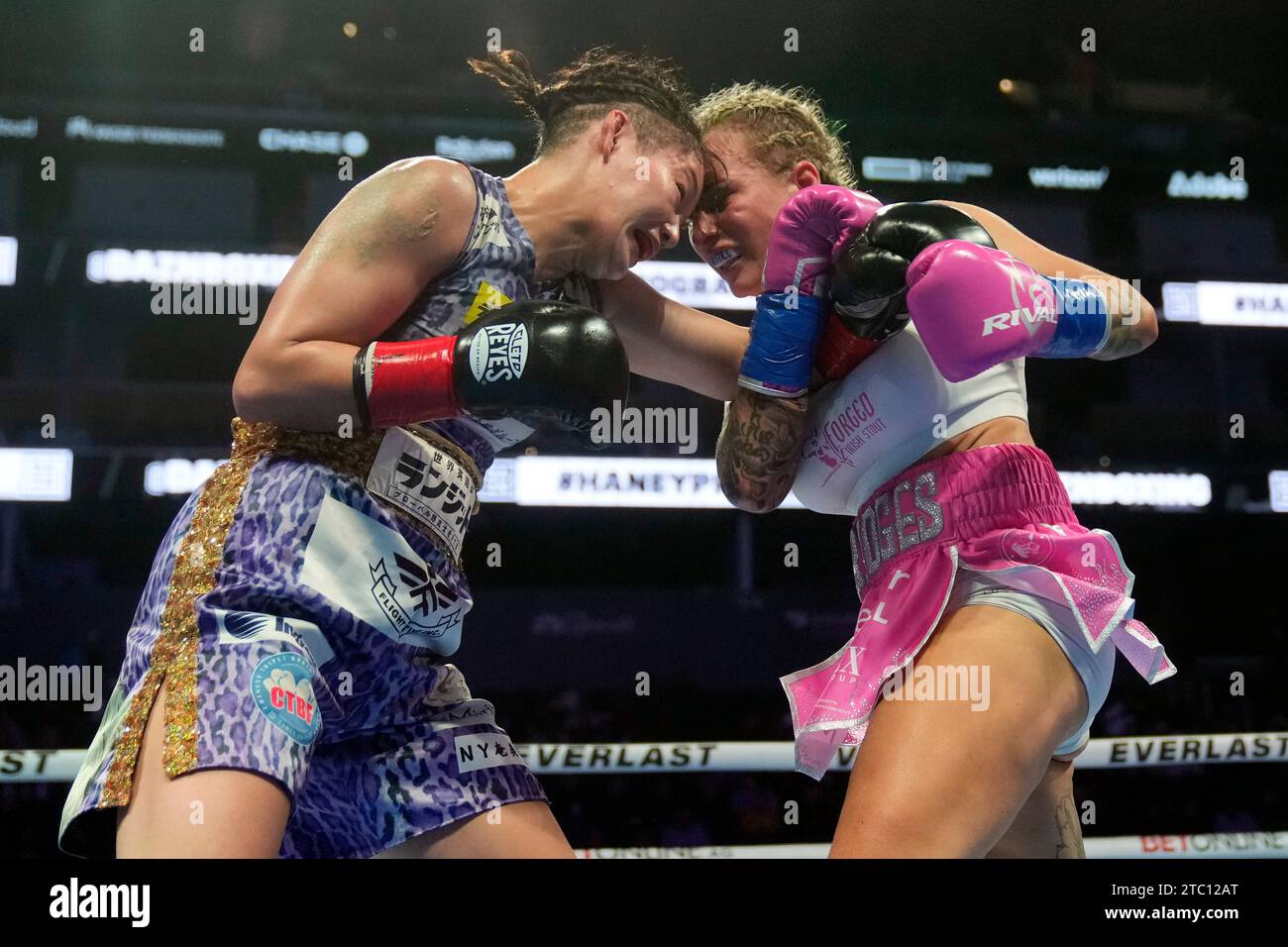 Miyo Yoshida, left, fights Ebanie Bridges during their IBF bantamweight ...