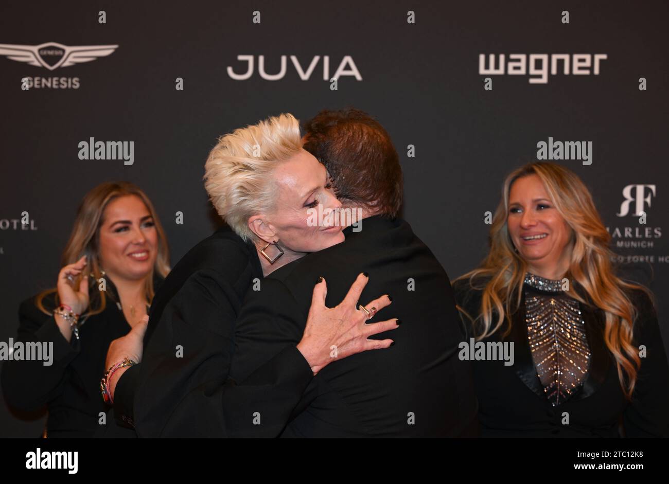 Munich, Germany. 09th Dec, 2023. Actress Brigitte Nielsen hugs ...