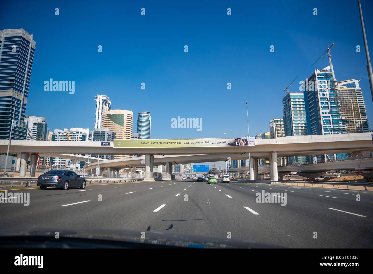 Dubai, UAE - December 1, 2023: View of the roadside from car windshield ...