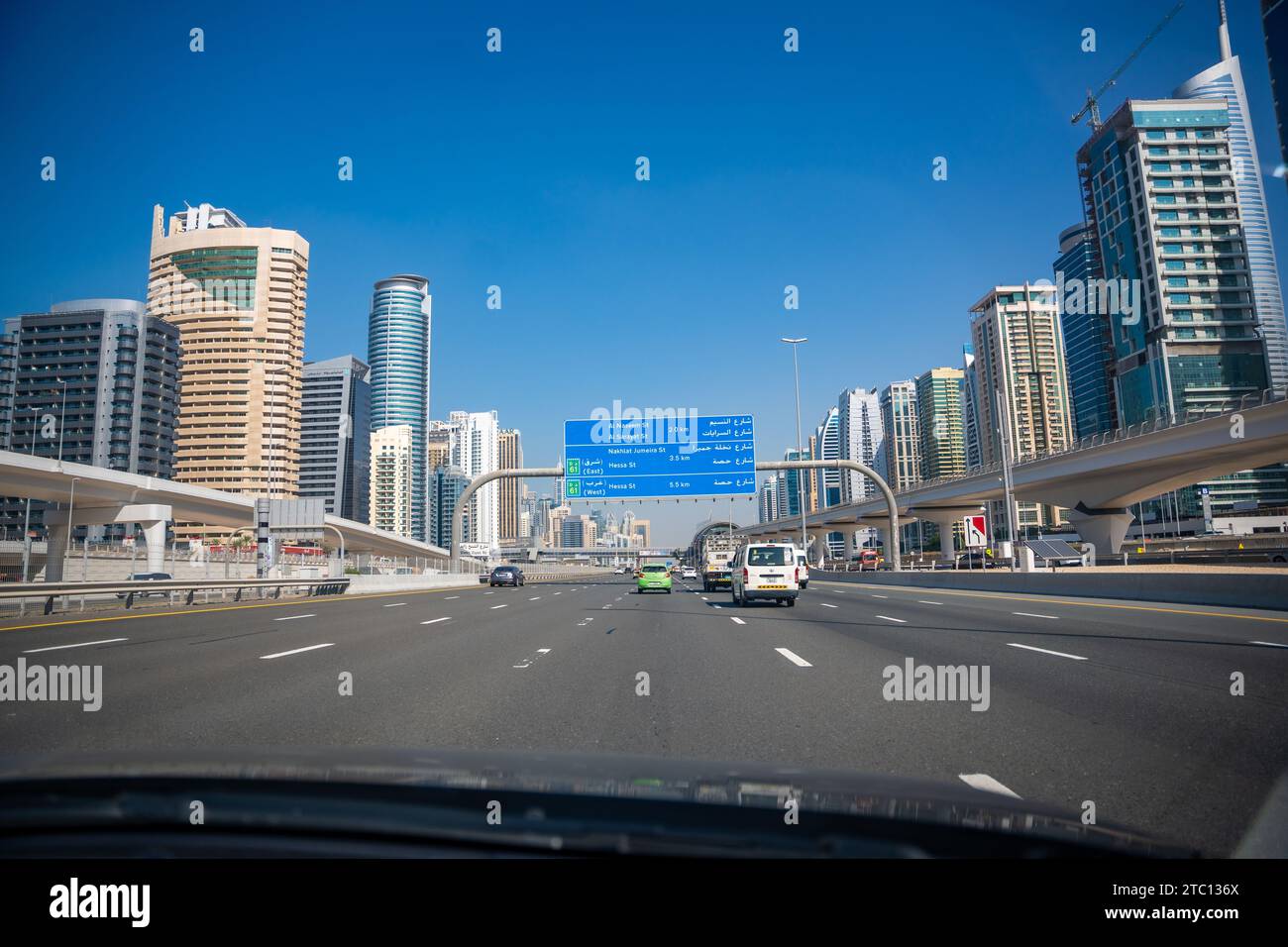 Dubai, UAE - December 1, 2023: View of the roadside from car windshield ...