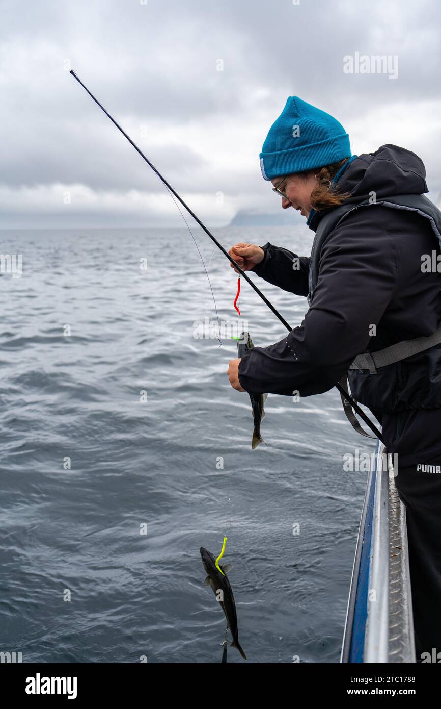 Happy Female Angler Displaying Her Fishing Success in the Norwegian Sea ...