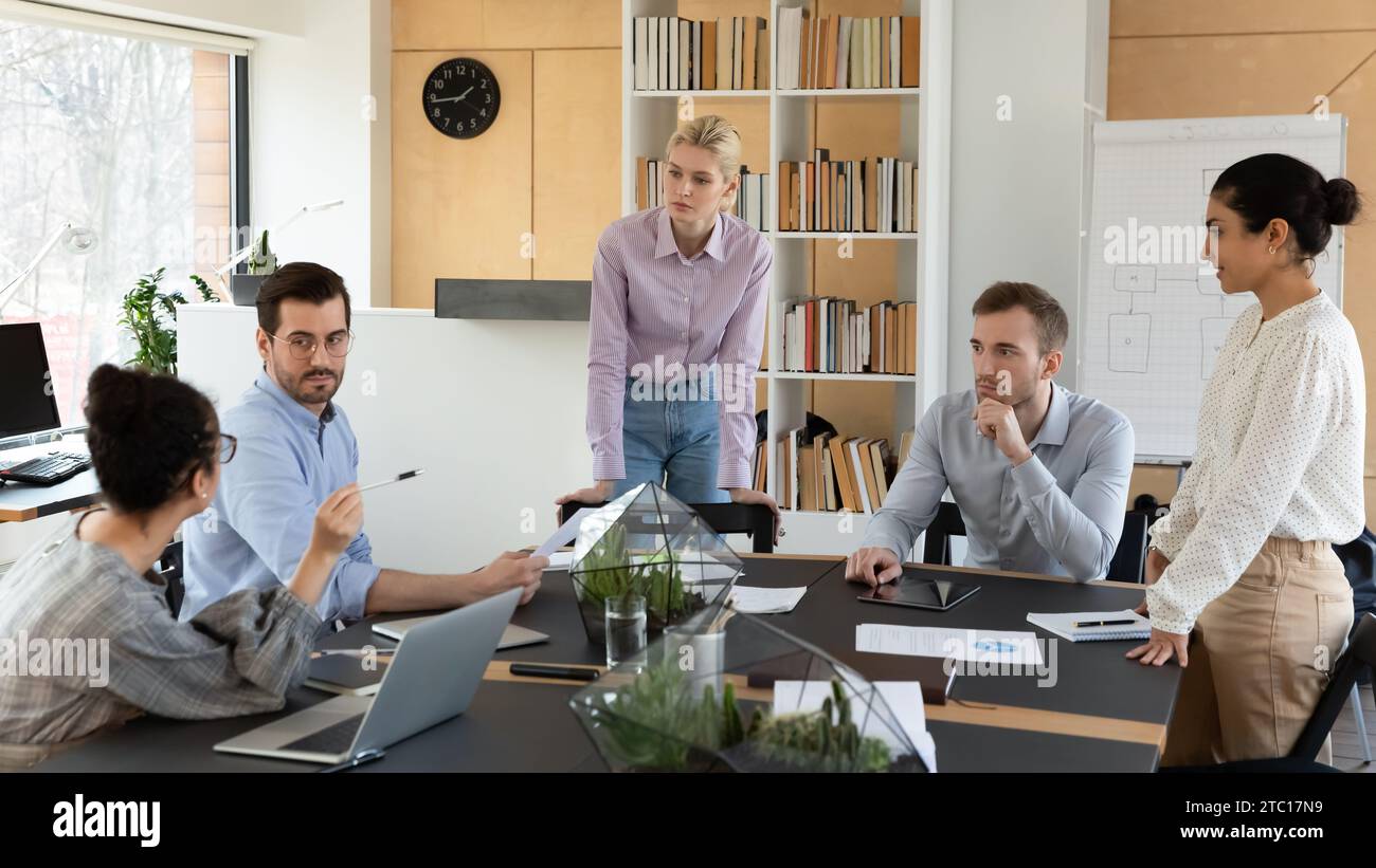 Multiethnic colleagues brainstorm at team meeting in office Stock Photo ...