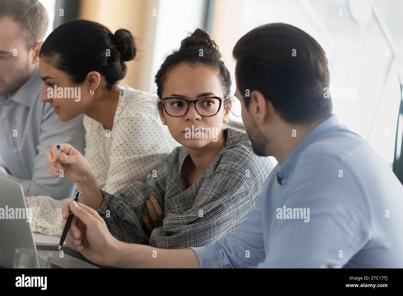 Multiracial business team using laptops hi-res stock photography and ...