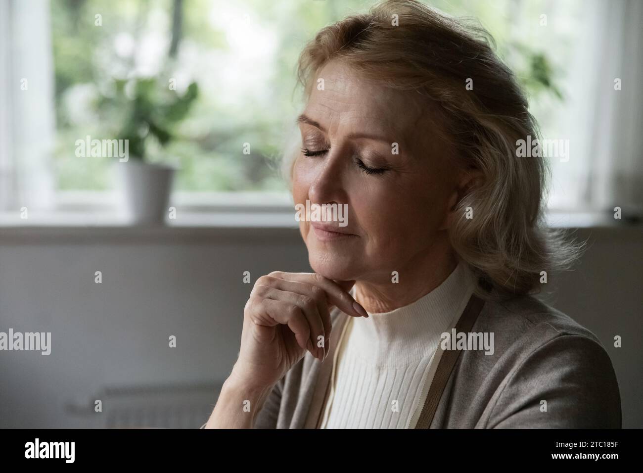 Elegant peaceful aged lady relaxing dreaming with closed eyes Stock ...